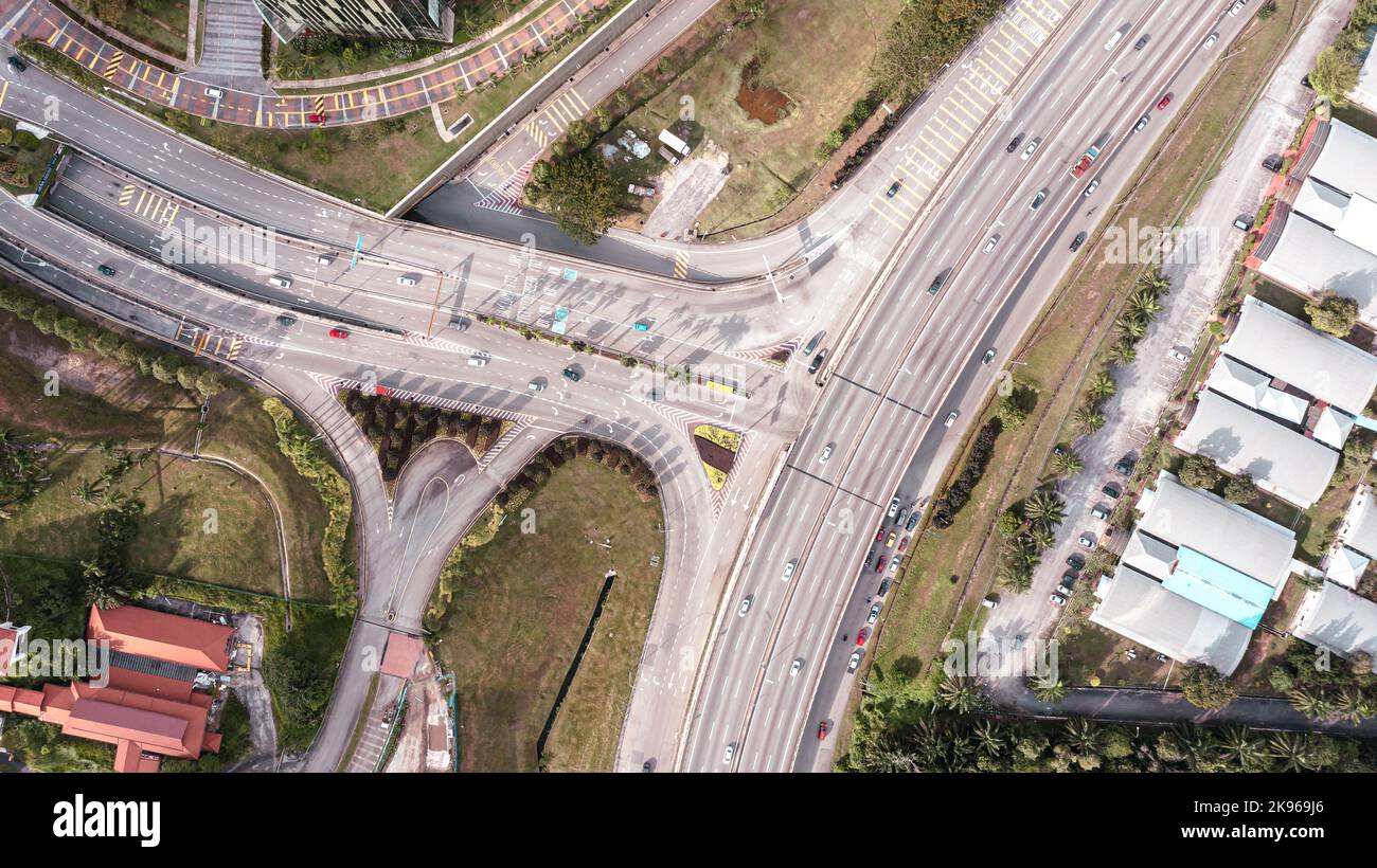 Aerial view directly above a highway exit. Top view of asphalt road ... Aerial view directly above a highway exit. Top view of asphalt road ...