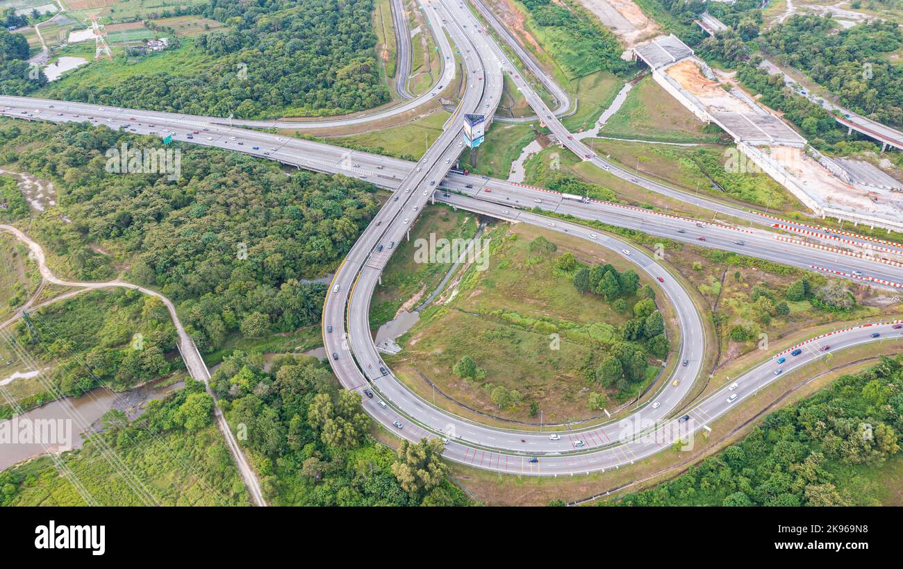 Aerial view of highway and overpass in city on a sunny day. Road ...