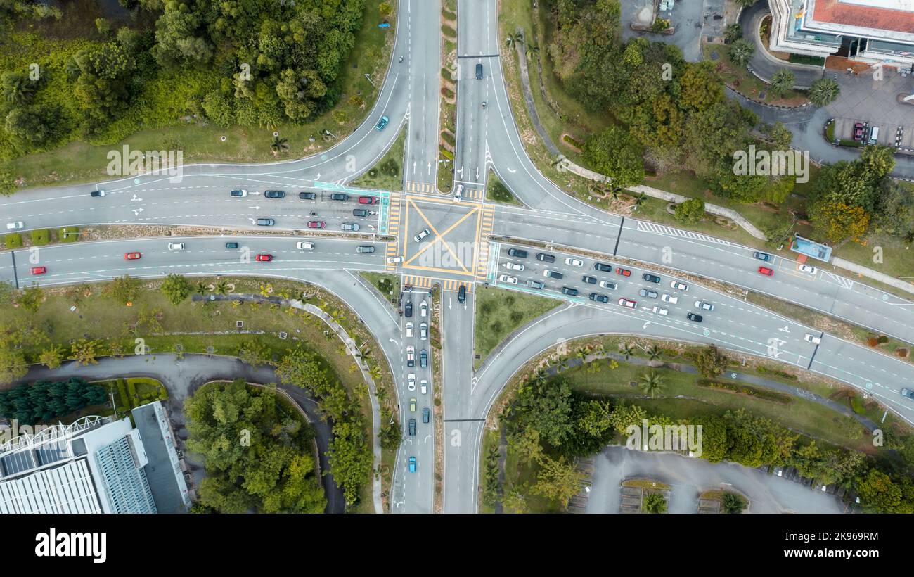 Traffic junctions, modern city. View from above to busy road junction ...