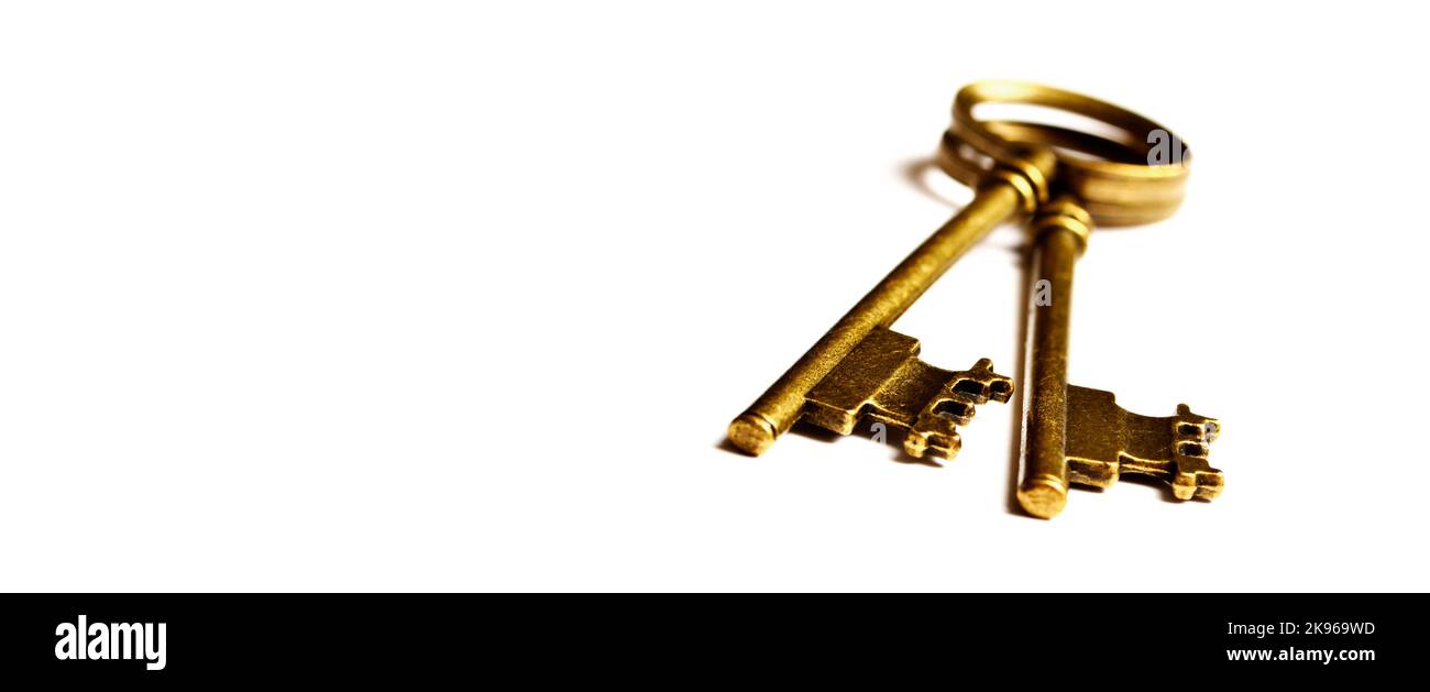 Old keys laying on top of white background isolated Stock Photo - Alamy