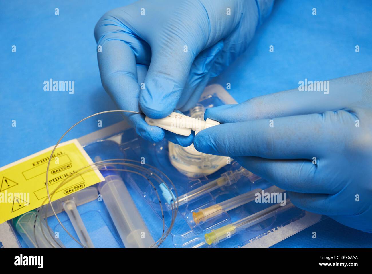 Preparation for epidural anesthesia. Hands of a medic in gloves and a ...