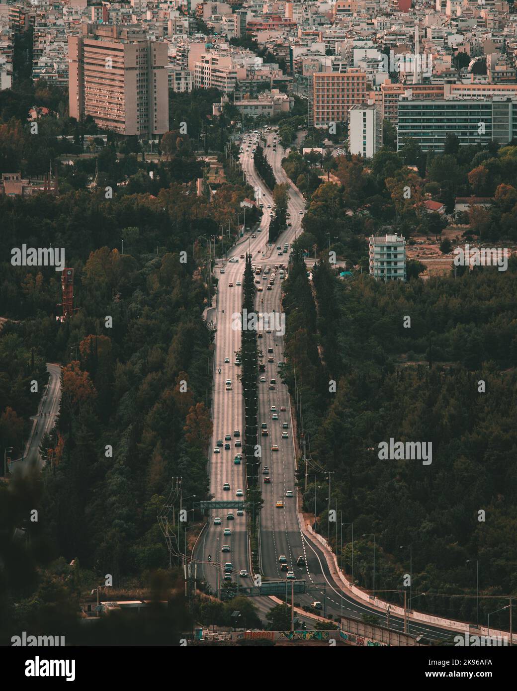 A vertical aerial view of Katehaki Avenue with cars near residential ...