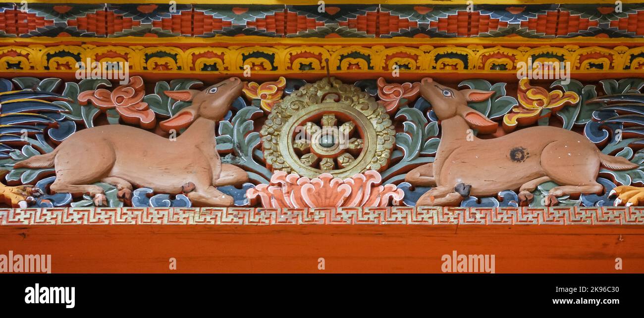 Carved wood symbol of the Buddha's first sermon in the deer park in ...