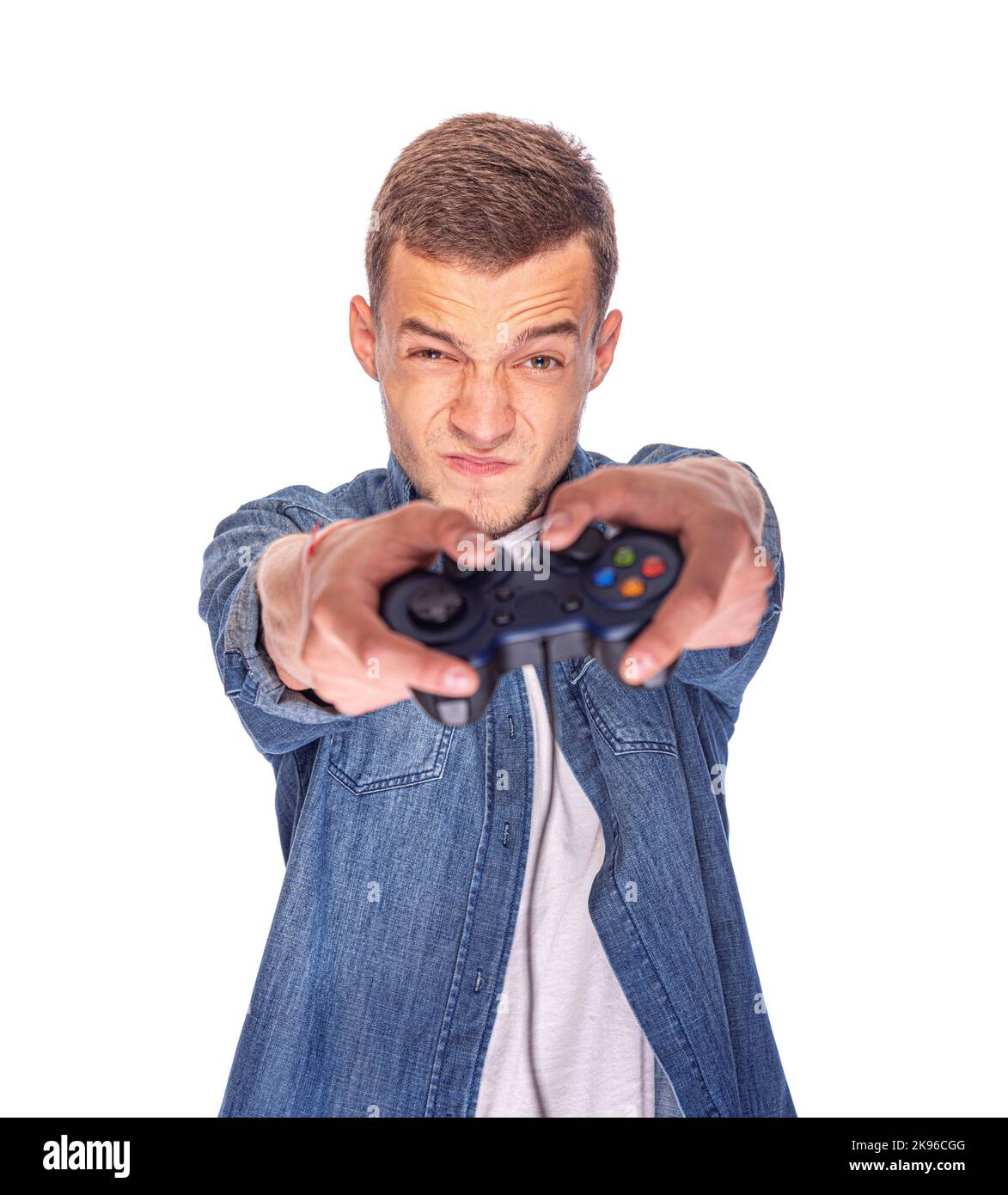 Young man playing on console or computer using a gamepad Stock Photo ...