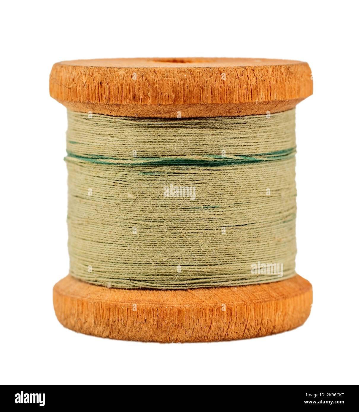 Old wooden spool of thread on a white background close-up. Threads for ...