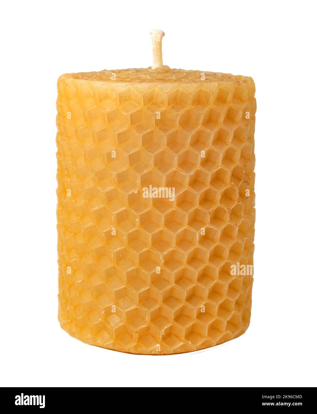 Beeswax candle with honeycomb texture isolate. Unlit candle on white ...
