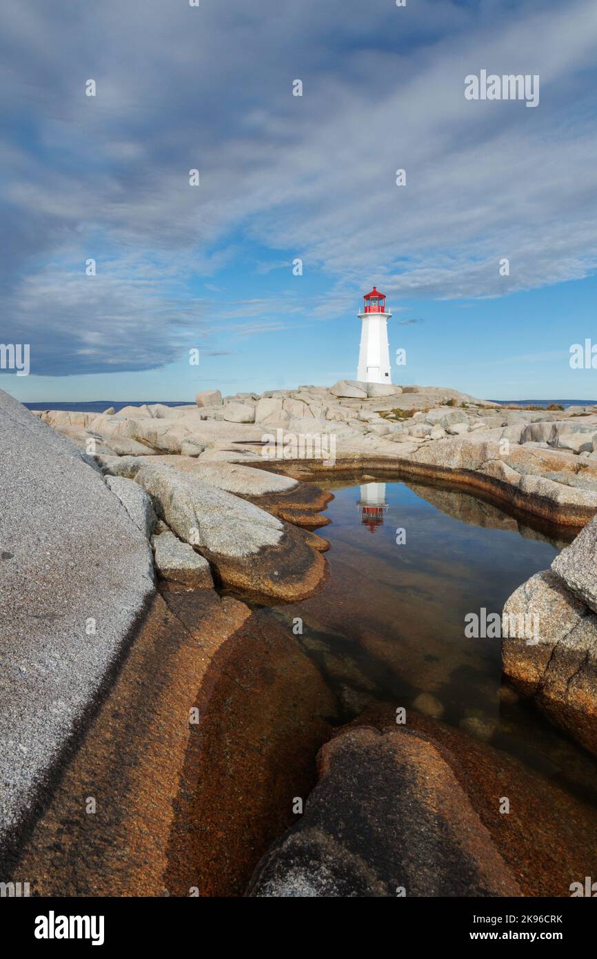 Peggys Cove Lighthouse view across the rocks taken on a crisp morning ...