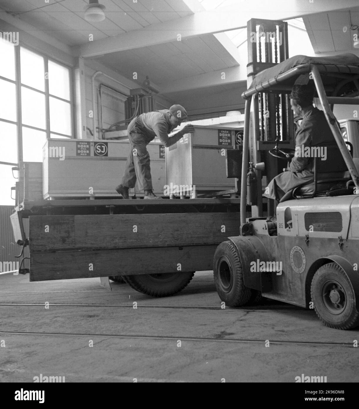 Small containers are loaded with truck, Liljeholmens cable plant Stock ...