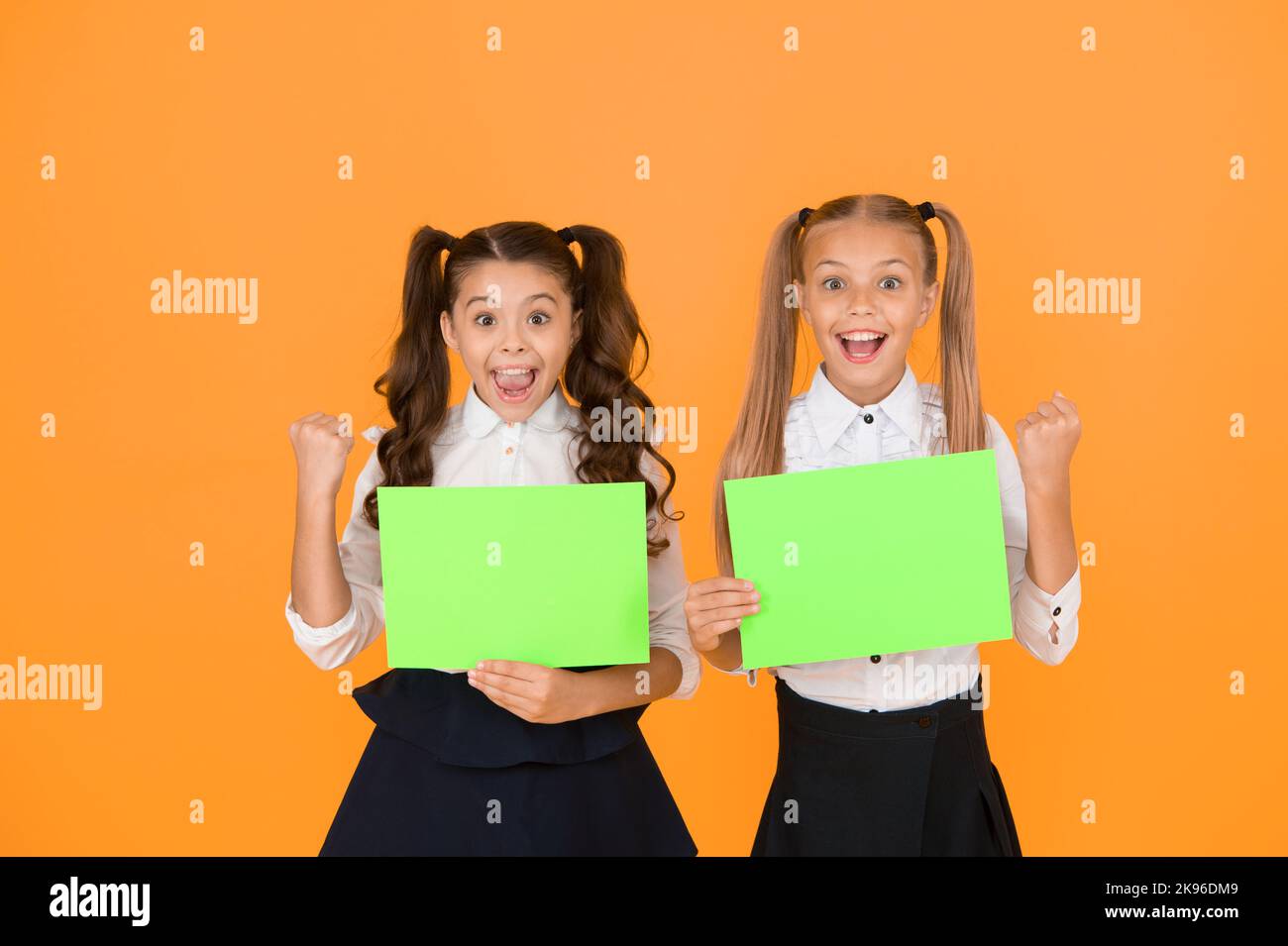 Homework done. Happy small children holding empty homework sheets on ...