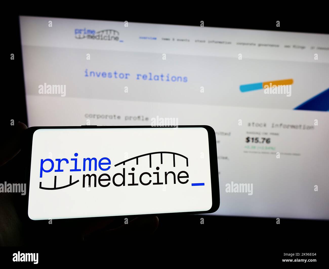 Person holding mobile phone with logo of US biotechnology company Prime ...
