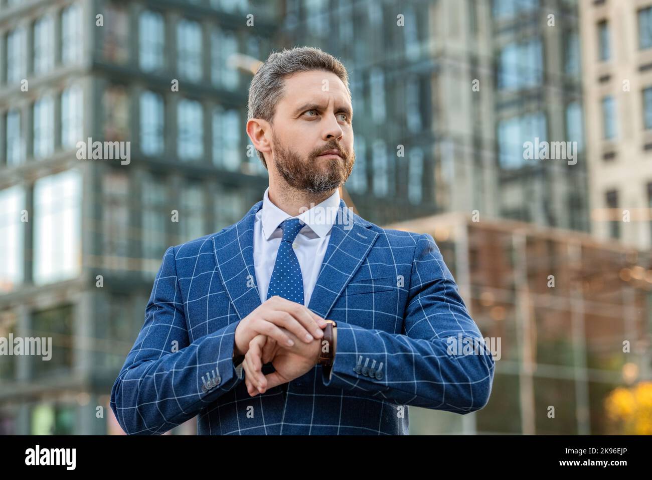 punctual businessperson outside. punctual businessperson in formalwear ...