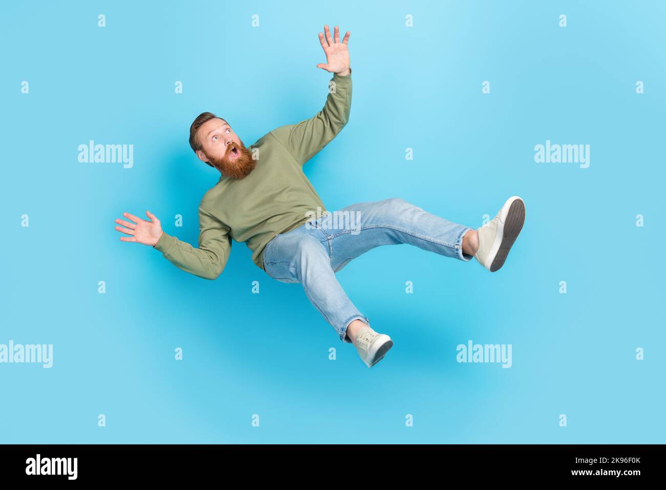 Full size photo of handsome young man frightened falling down slipping ...