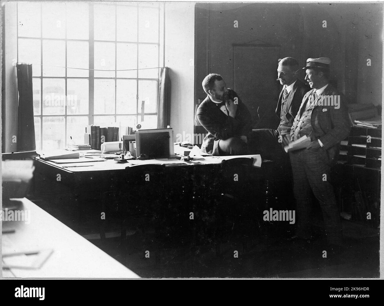 Three men in conversation Stock Photo - Alamy