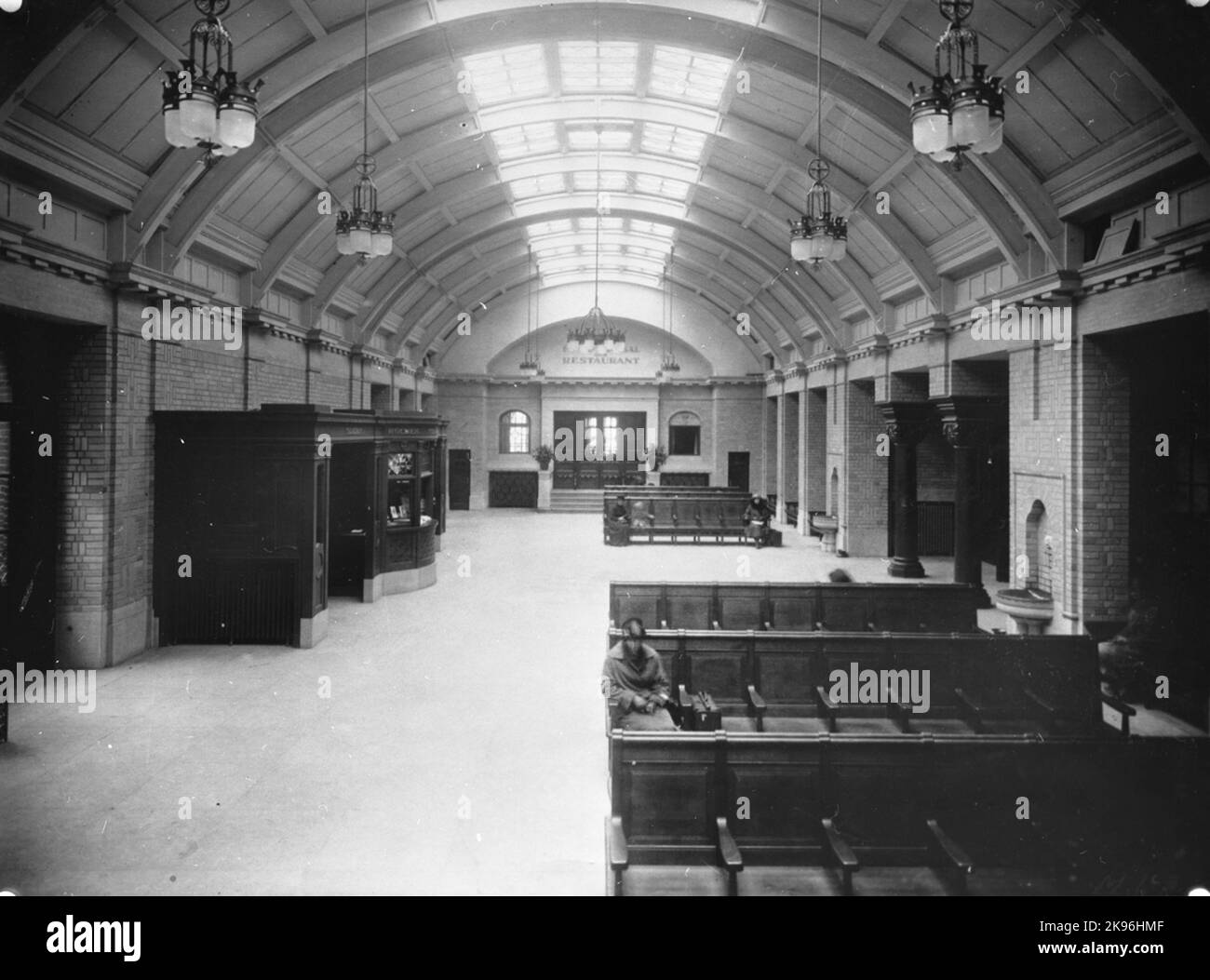 The waiting hall with entrance to I and II class waiting room and ...