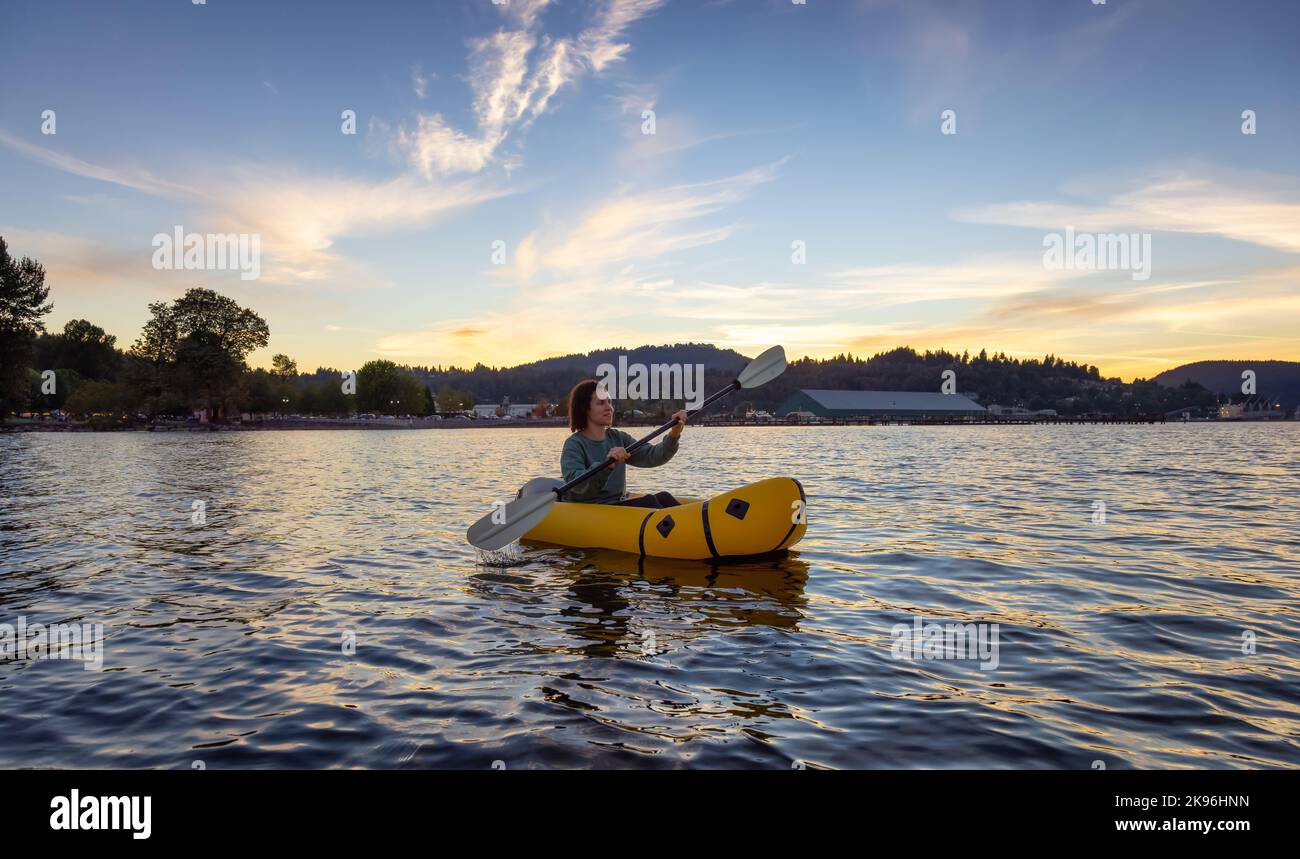 Adventurous Woman Kayaking on an Inflatable Kayak in the Pacific Ocean ...