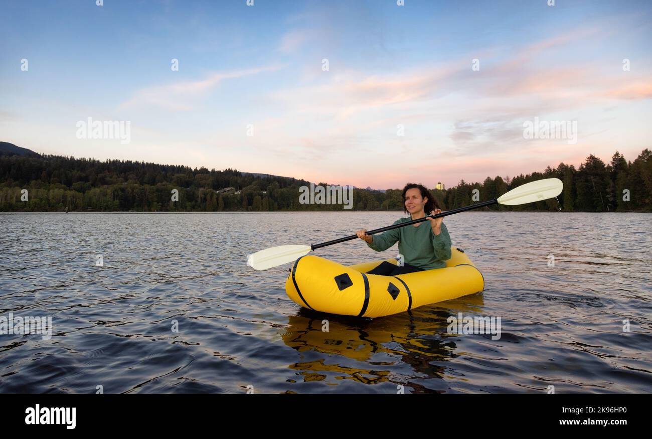 Adventurous Woman Kayaking on an Inflatable Kayak in the Pacific Ocean ...