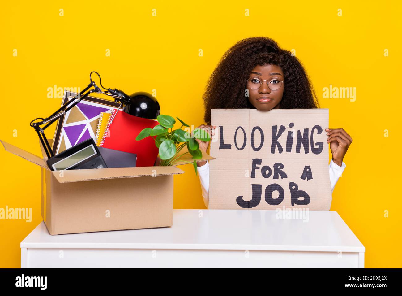 Portrait of unsatisfied girl hold paper looking job banner stuff box ...