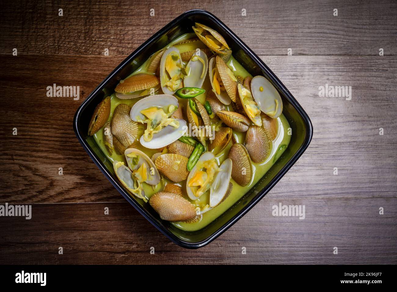 Lala or saltwater clams cooked in green curry and garnished with green ...