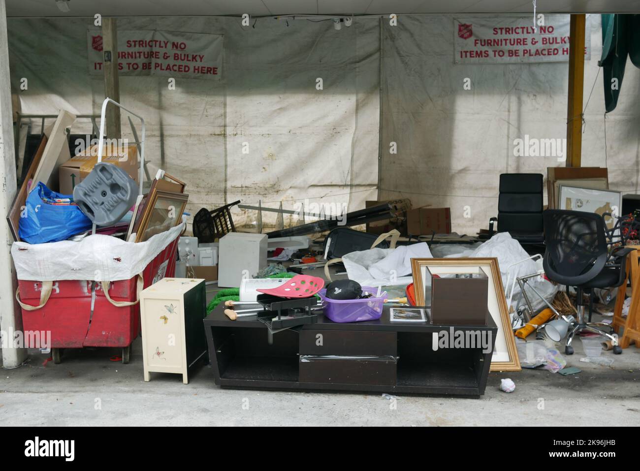 Singapore 12 June 2022. dumped donated items in a large container ...