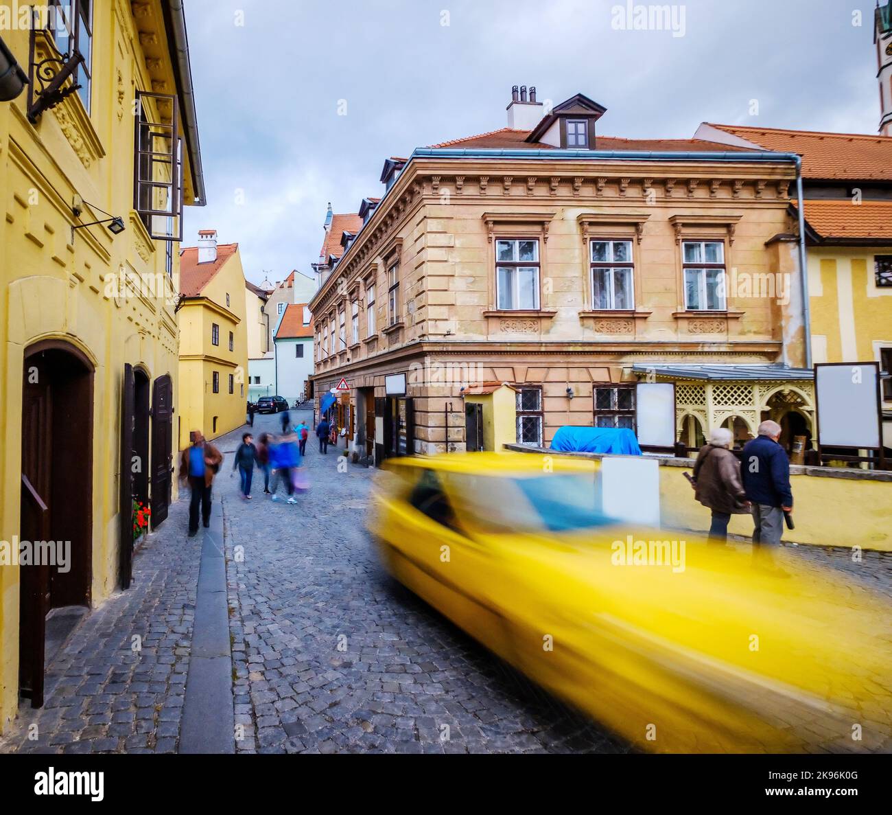 Historical street with small houses full of tourists Stock Photo - Alamy