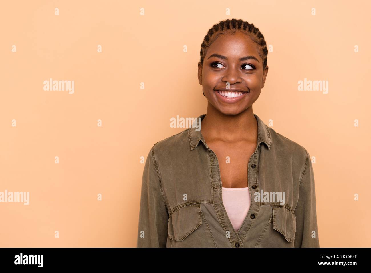 Portrait of positive pretty person toothy smile look interested empty ...