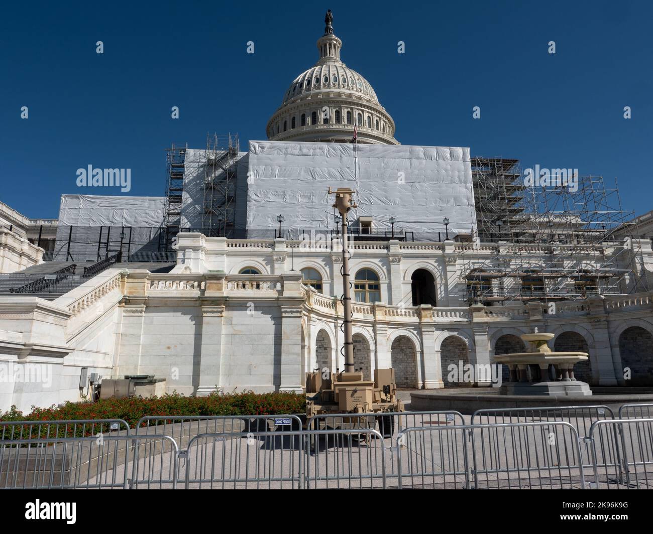 A security tower with cameras in front of renovations at the United ...