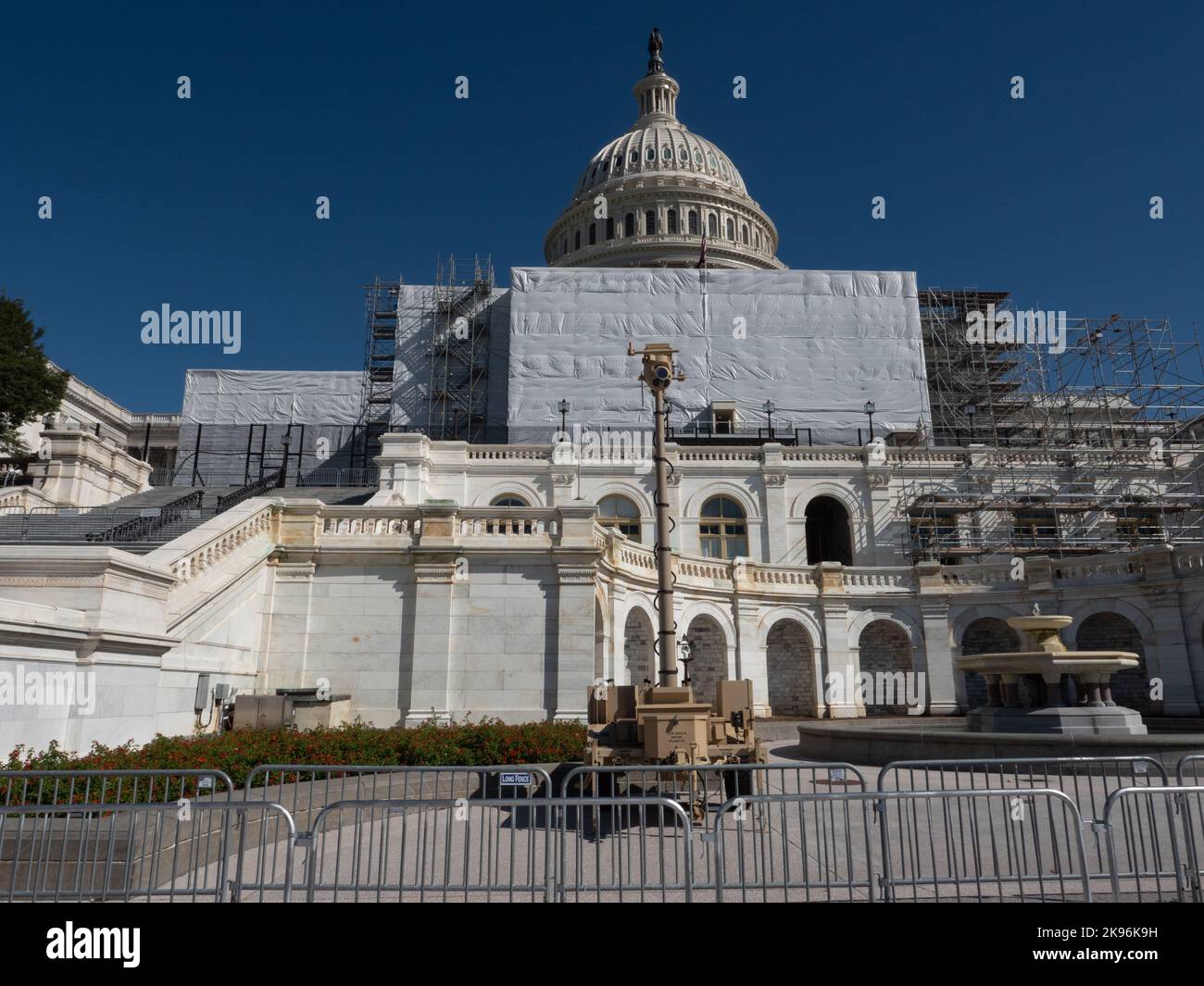 A security tower with cameras in front of renovations at the United ...