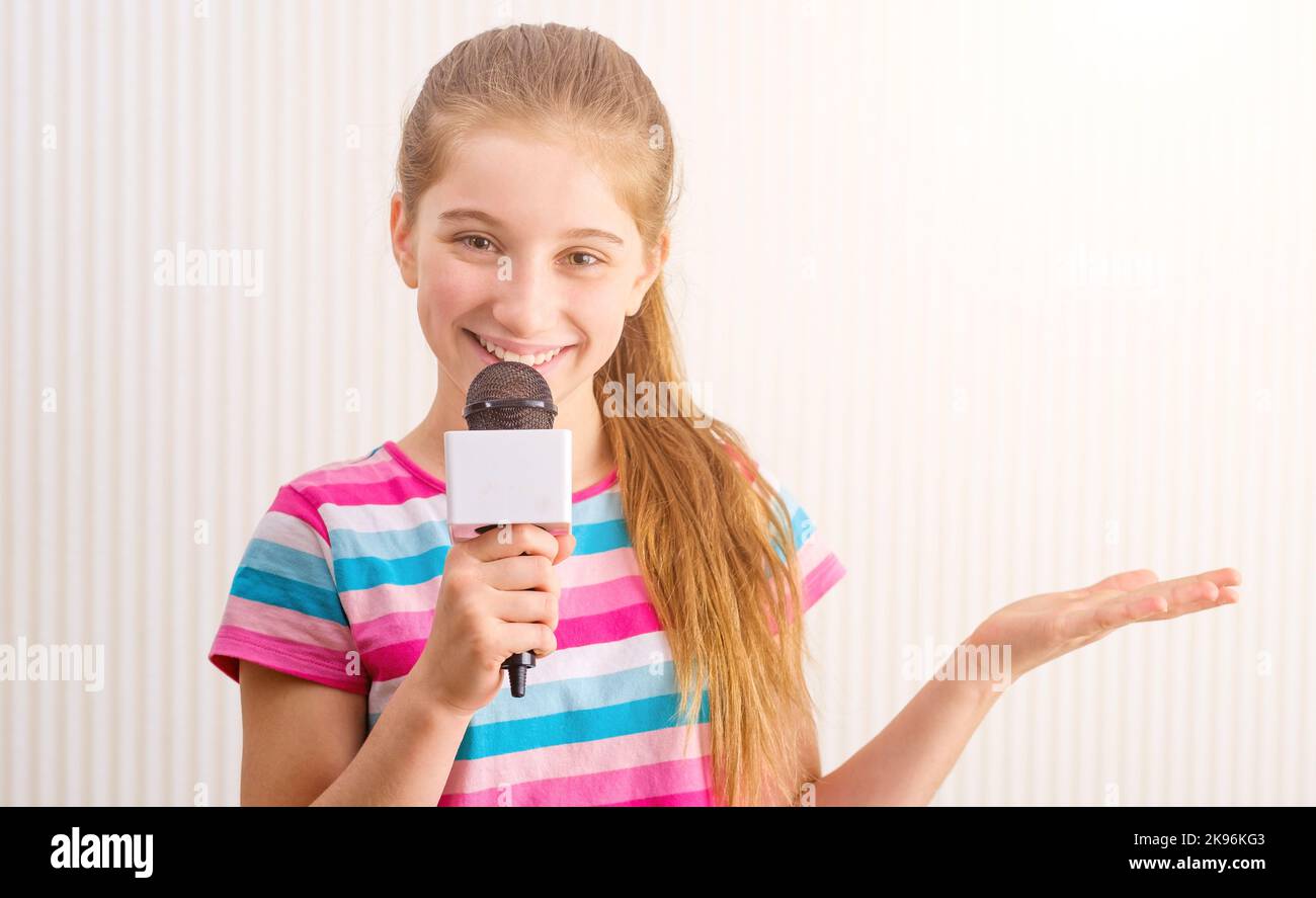 Female blogger with microphone Stock Photo - Alamy