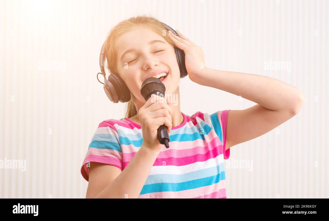 Cheerful little singer Stock Photo - Alamy