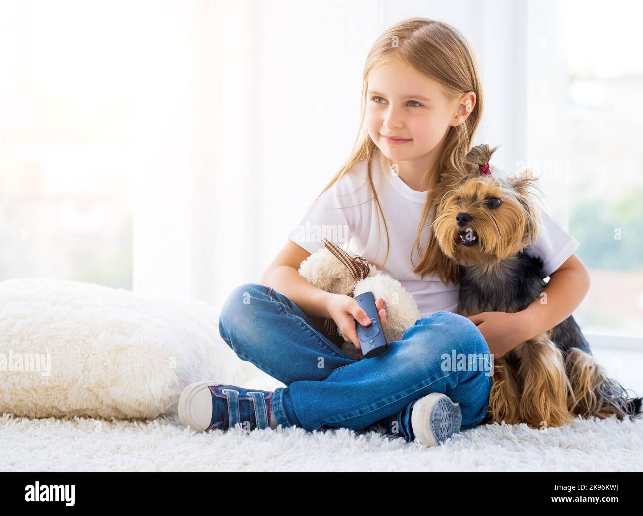 Girl hugging dog Stock Photo - Alamy