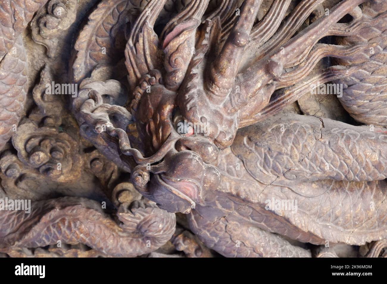 A closeup of a ceiling decoration of a dragon in the Temple of ...
