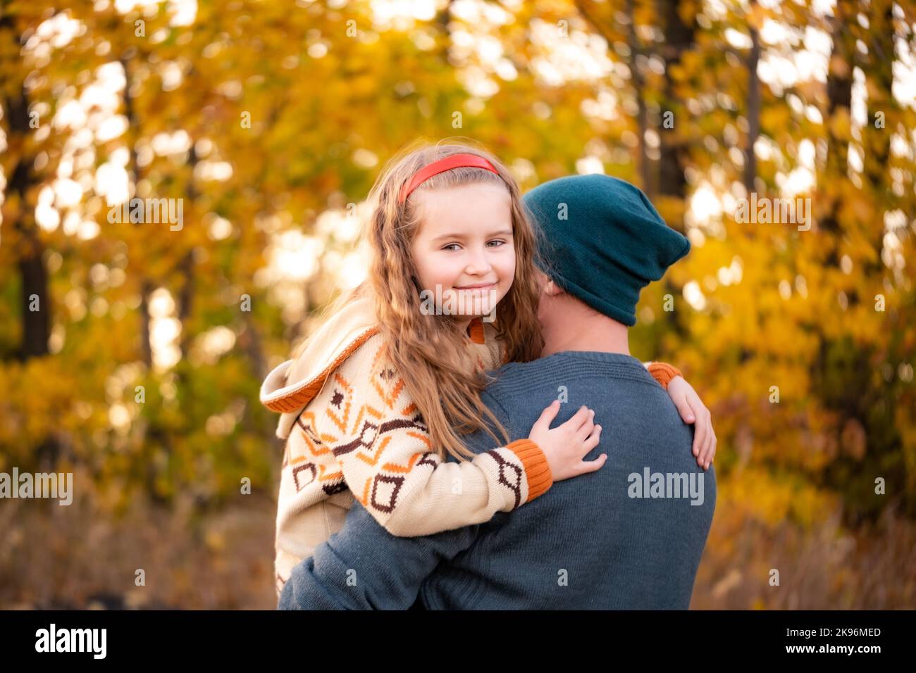 Father hugs with daughter Stock Photo - Alamy