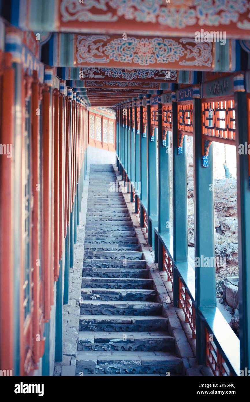 A vertical shot of narrow staris in the Beihai Park in Beijing, China ...