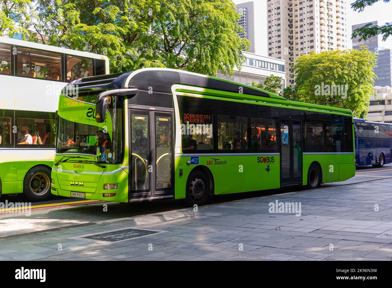 A passing bus in Singapore Stock Photo - Alamy