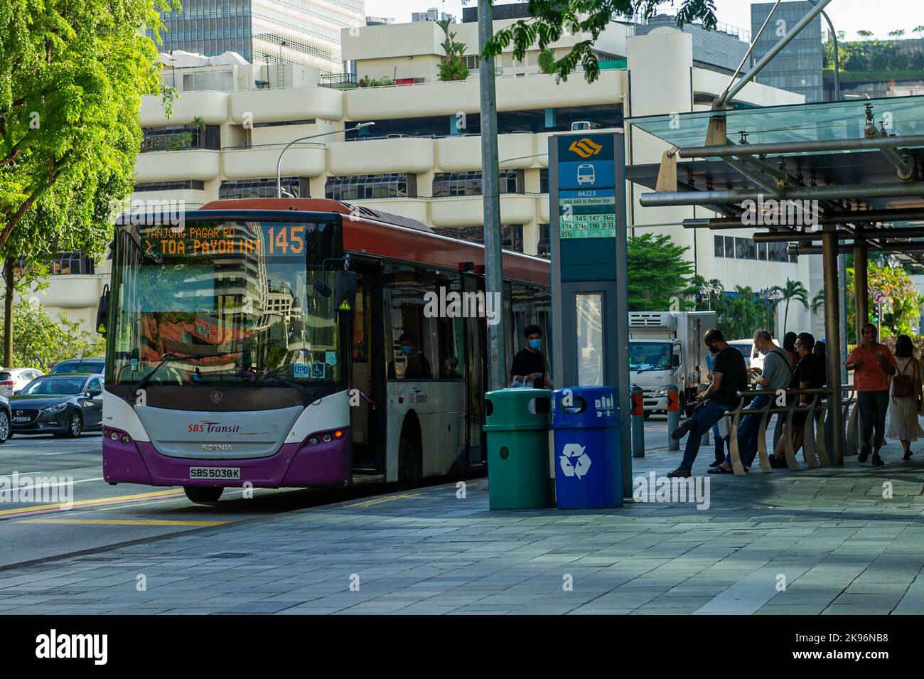 A passing bus in Singapore Stock Photo - Alamy