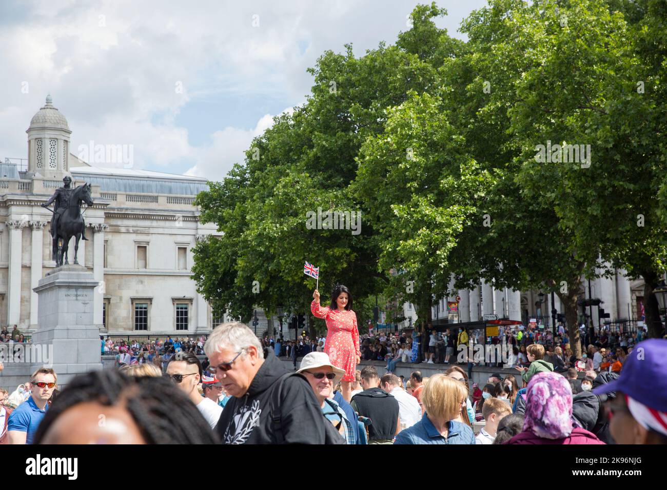 Revellers with Union flags gather in Trafalgar Square, central London ...
