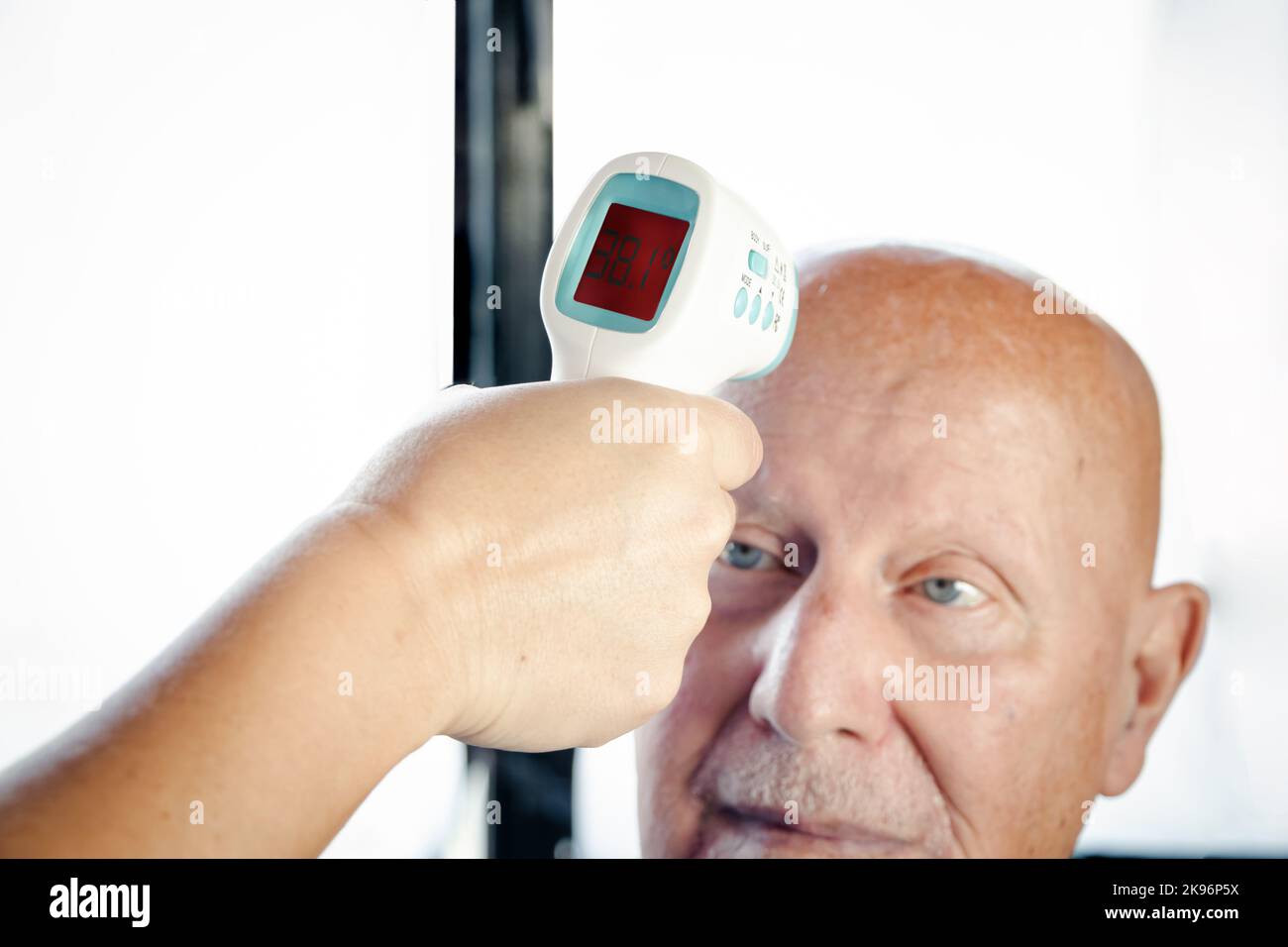 Doctor taking temperature hi-res stock photography and images - Alamy