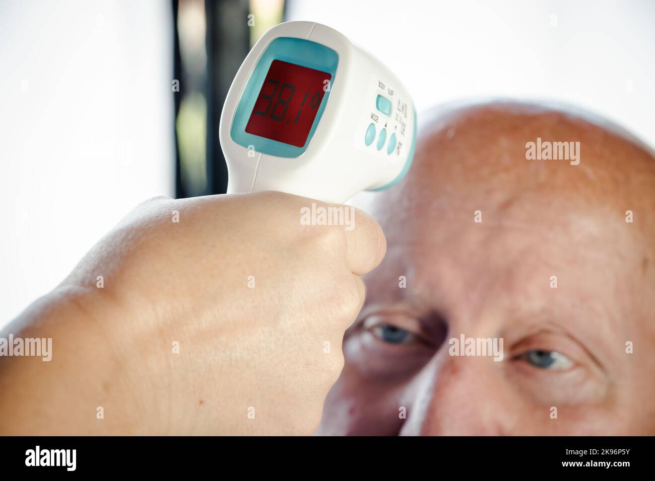 Doctor taking temperature hi-res stock photography and images - Alamy