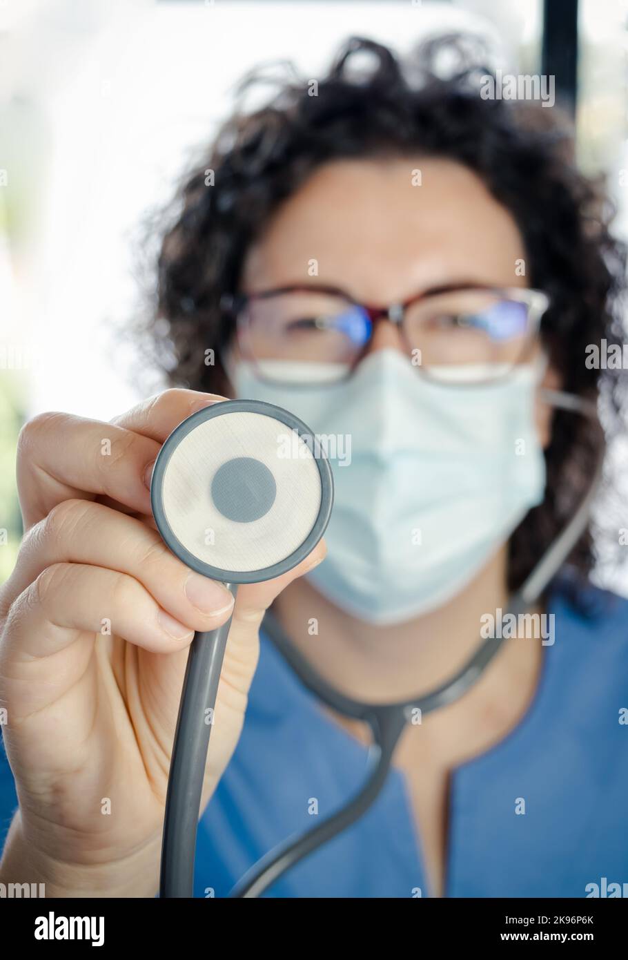 Doctor auscultating patient by stethoscope hi-res stock photography and ...