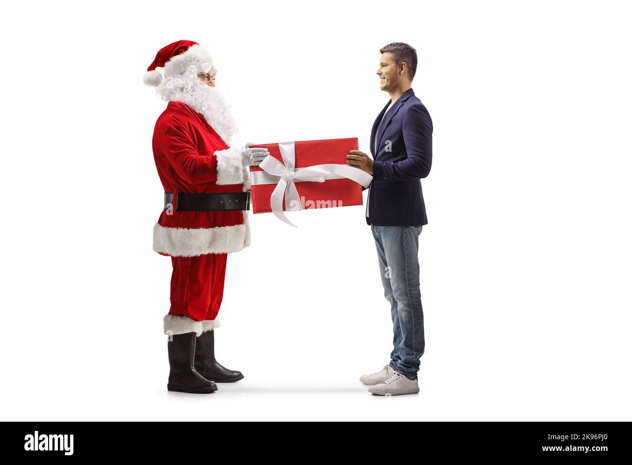 Full length profile shot of santa claus handing a present to a man ...