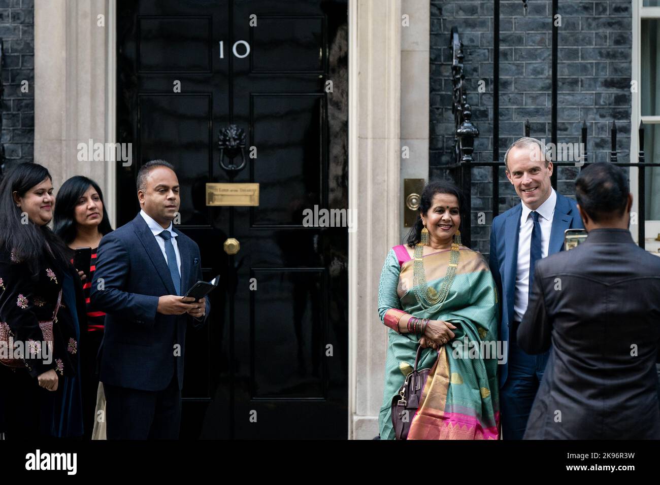 Deputy Prime Minister Dominic Raab poses with guests as they arrive at ...
