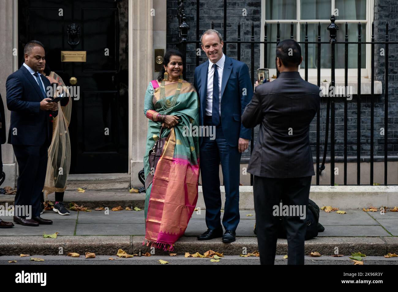 Deputy Prime Minister Dominic Raab poses with guests as they arrive at ...