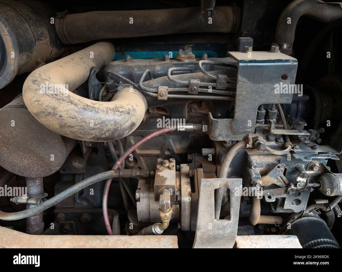 Closeup of the old tractor engine after being used on the countryside ...