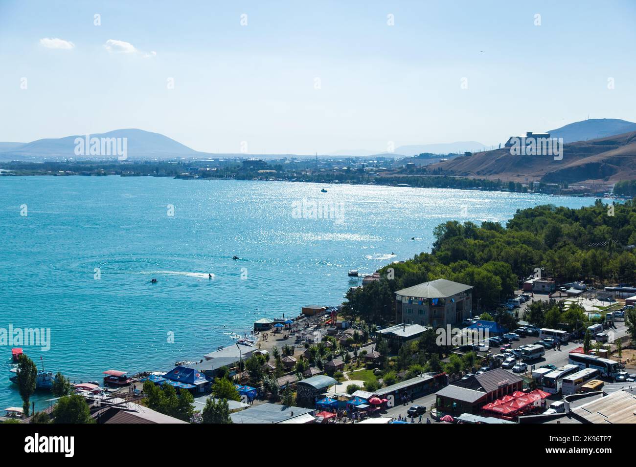 A village near the ocean with a sunlight over the mountain Stock Photo ...
