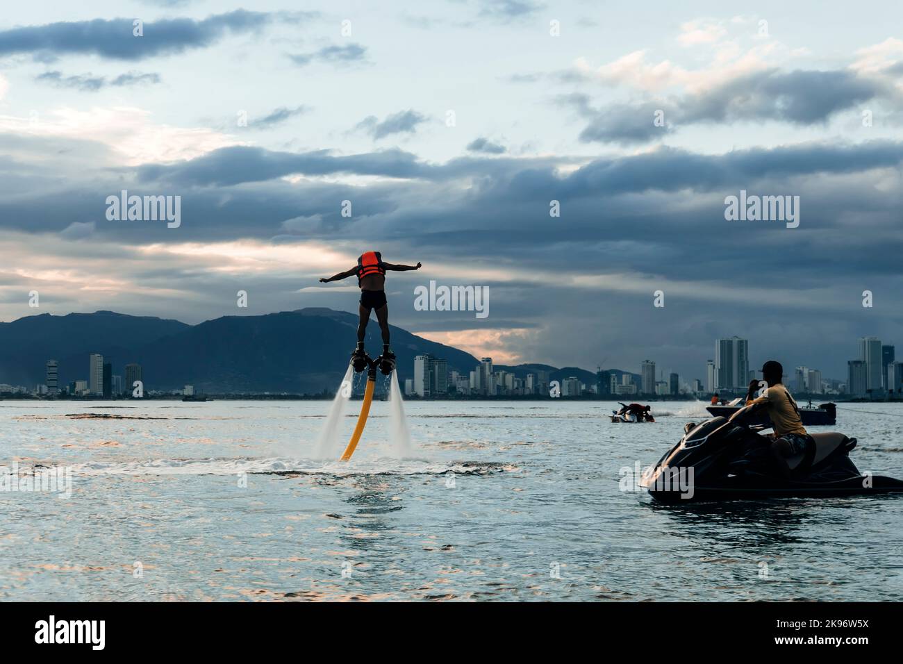 The new spectacular sport, man showing the fly board in the sea at ...