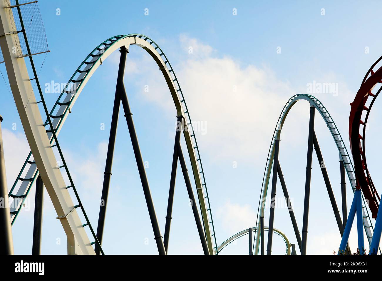 Attractions roller coaster, switchback, on the background of the blue ...