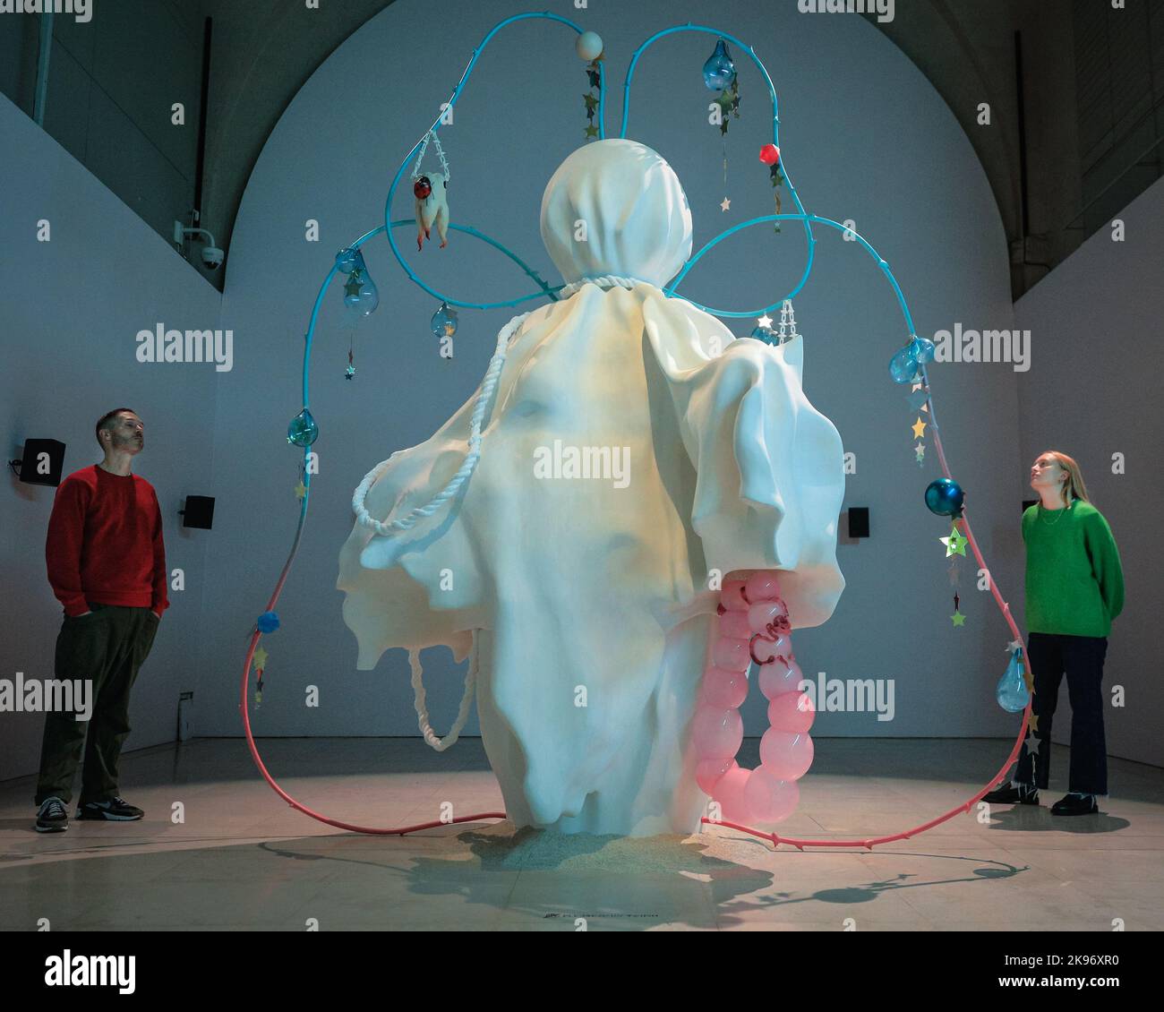 London, UK. 26th Oct, 2022. Staff pose with Tai Shani's 'The Neon ...