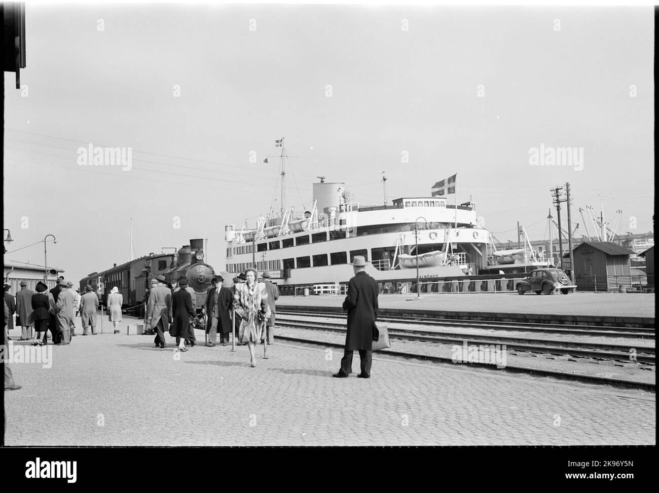 Passenger train at port station. Vessels "Malmöhus" are waiting for ...