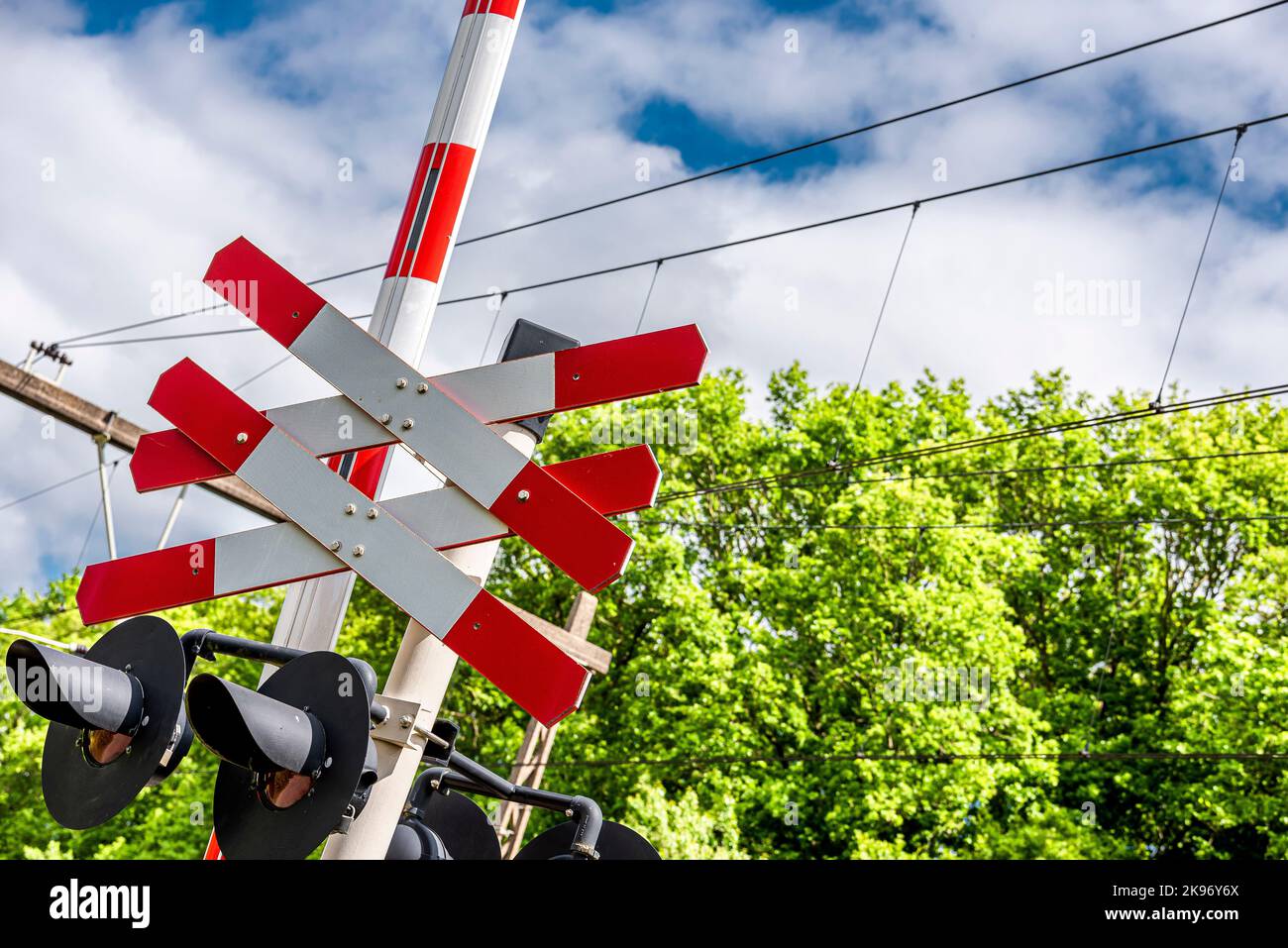 A red and white railroad crossing sign with warning lights Stock Photo ...