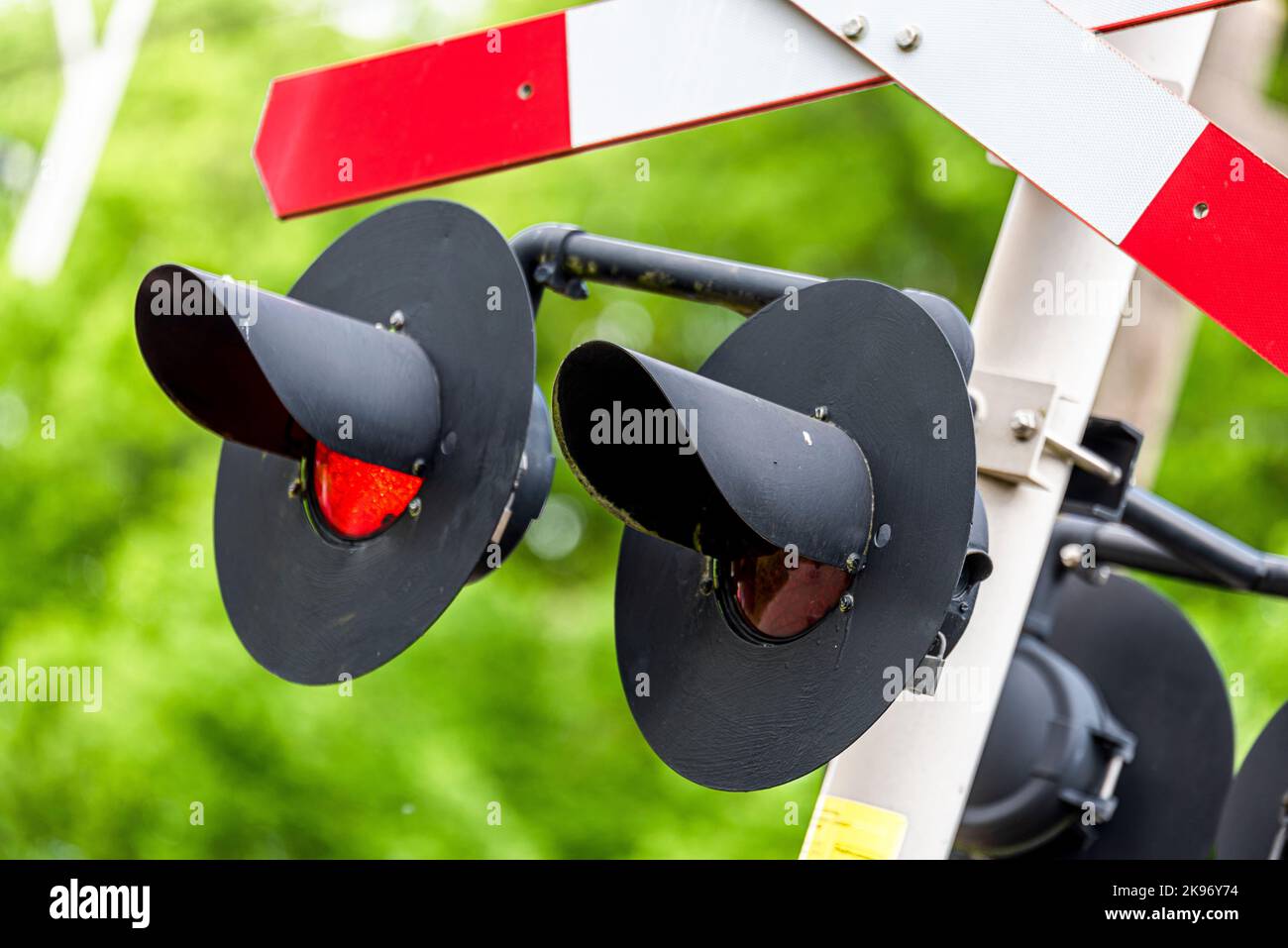 A red and white railroad crossing sign with two warning lights Stock ...